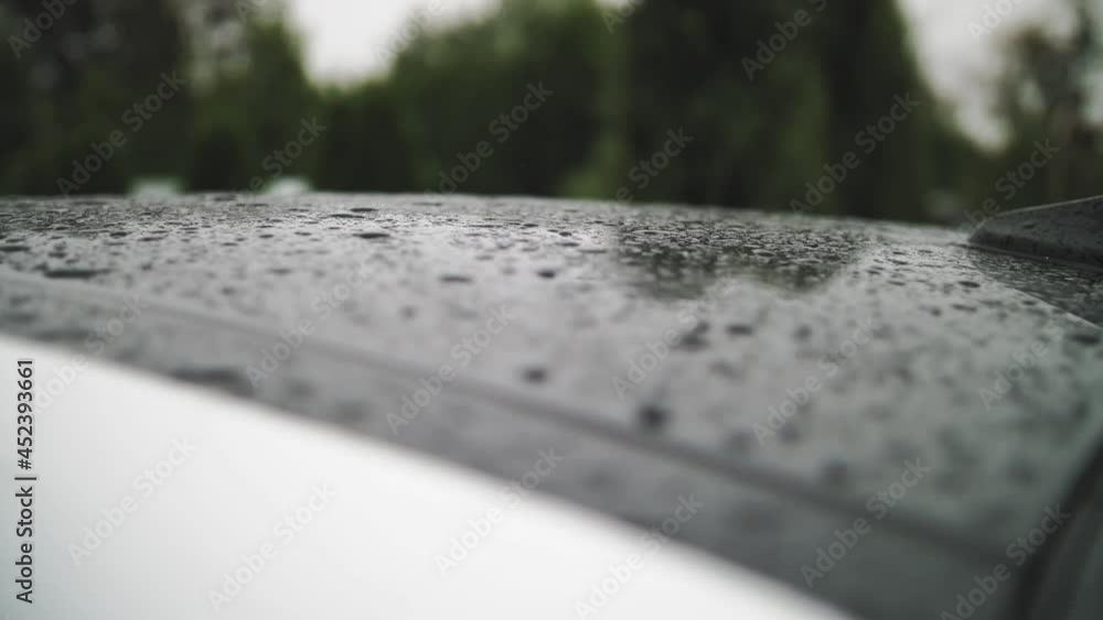 Stockvideon raindrops on car. rain. raining. raindrops fall with ...