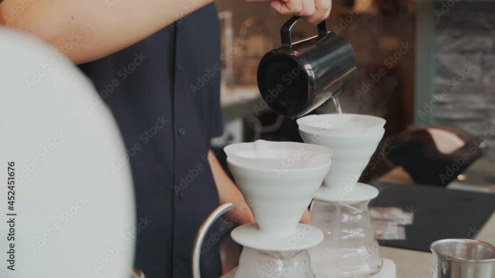 barista man making craft filter drip coffee at bar in coffee shop ...