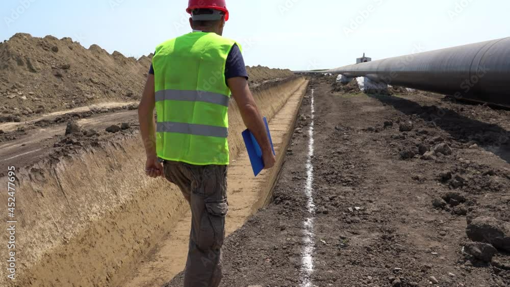 Construction Foreman Checking Progress at Gas Pipeline Construction ...