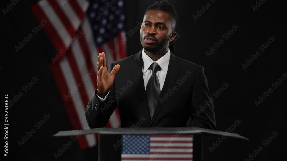 Serious professional African American politician man standing at ...