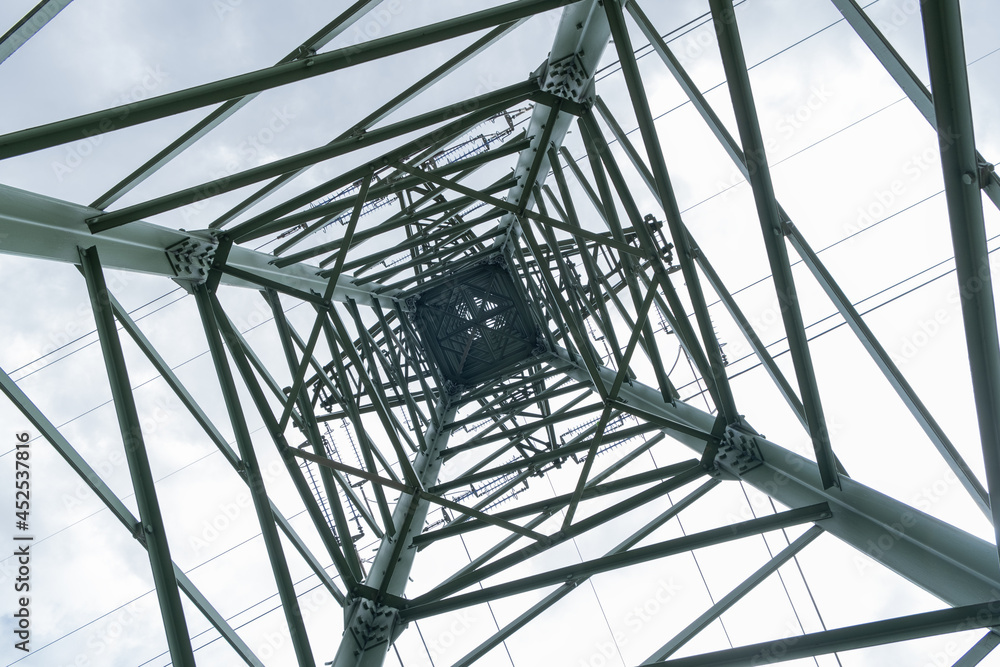 High metal electro tower against the sky. High voltage Power lines ...