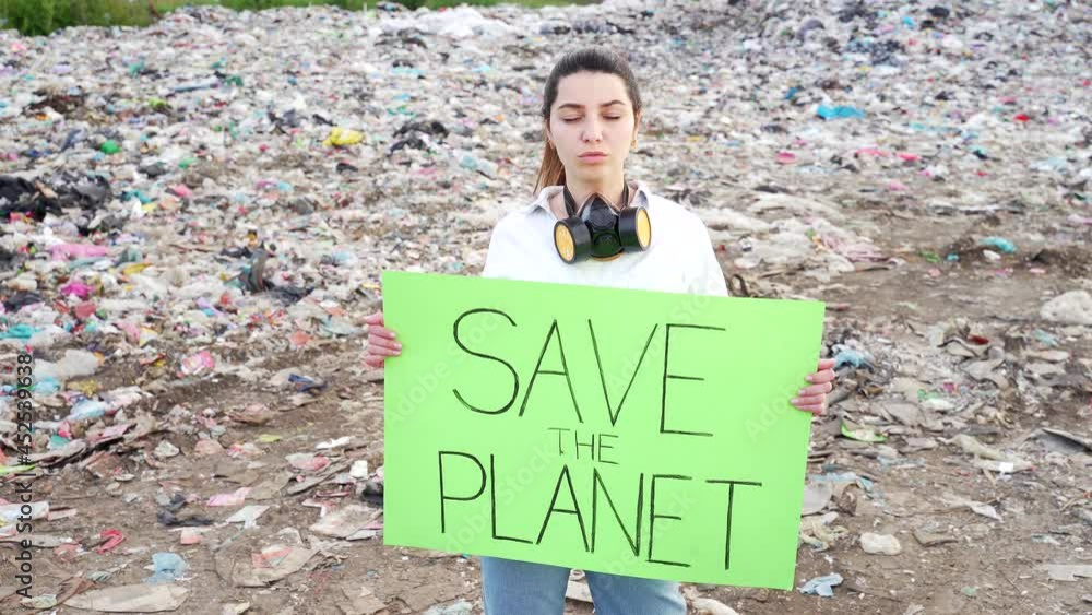 Vidéo Stock portrait young woman activist with a poster in hands save ...