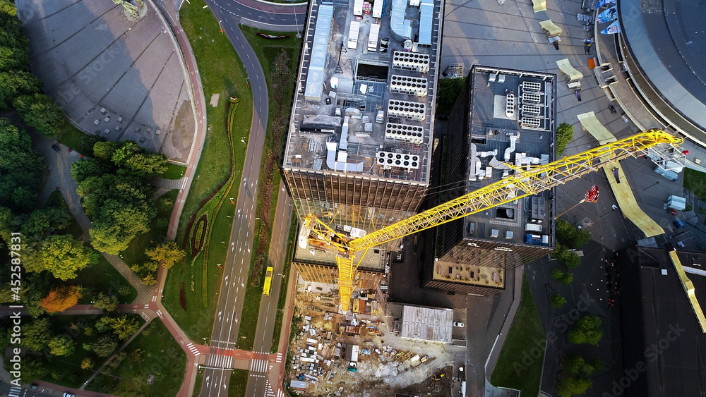 Modern, high-rise glass building under construction, aerial view ...
