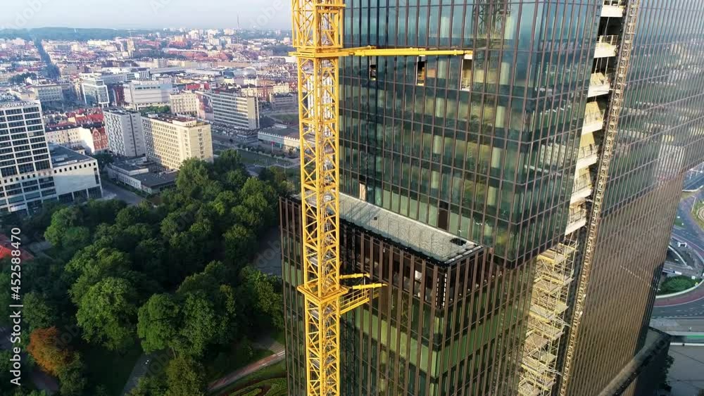 Business skyscraper under construction, aerial view. Construction of a ...