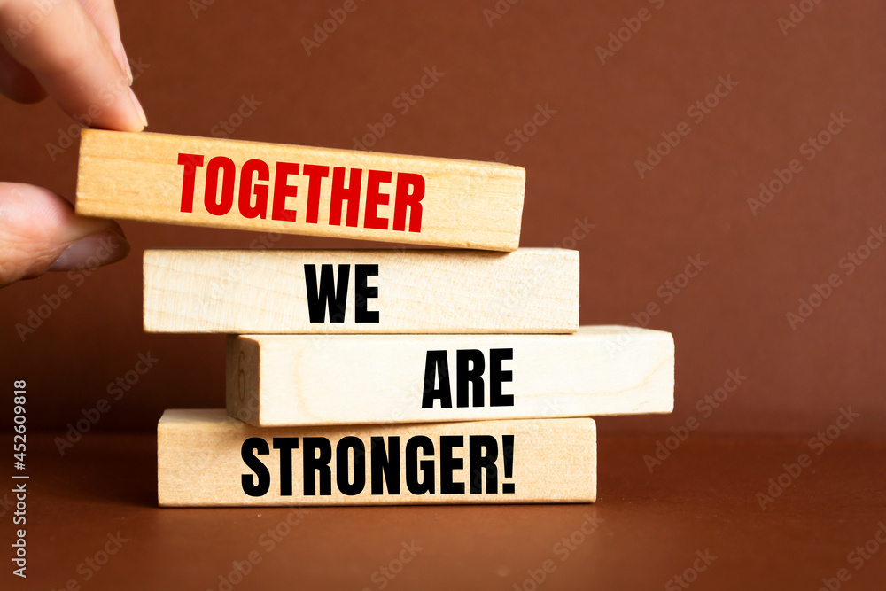 Together we are stronger symbol. Wooden blocks with words 'together we ...