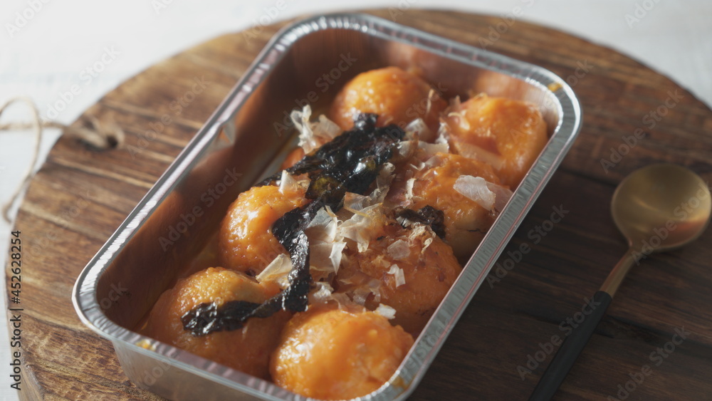 a close-up view of delectable takoyaki (Japanese octopus dumplings ...