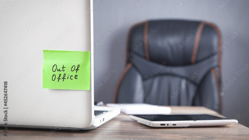 Out of office message on sticky note with computer. Stock Photo | Adobe ...