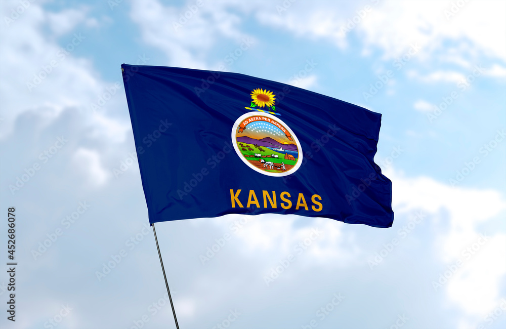 Flag of Kansas in front of blue sky, realistic 3D rendering Stock ...