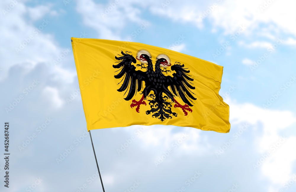 Holy Roman Empire Flag, realistic 3d rendering in front of blue sky ...