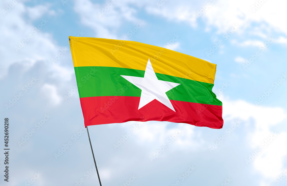 Flag of Myanmar, realistic 3d rendering in front of blue sky Stock ...