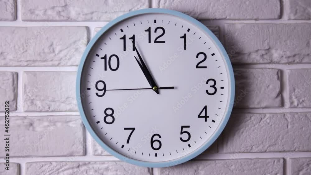 Classic analog clock pointing at ten fifty five, isolated on white ...