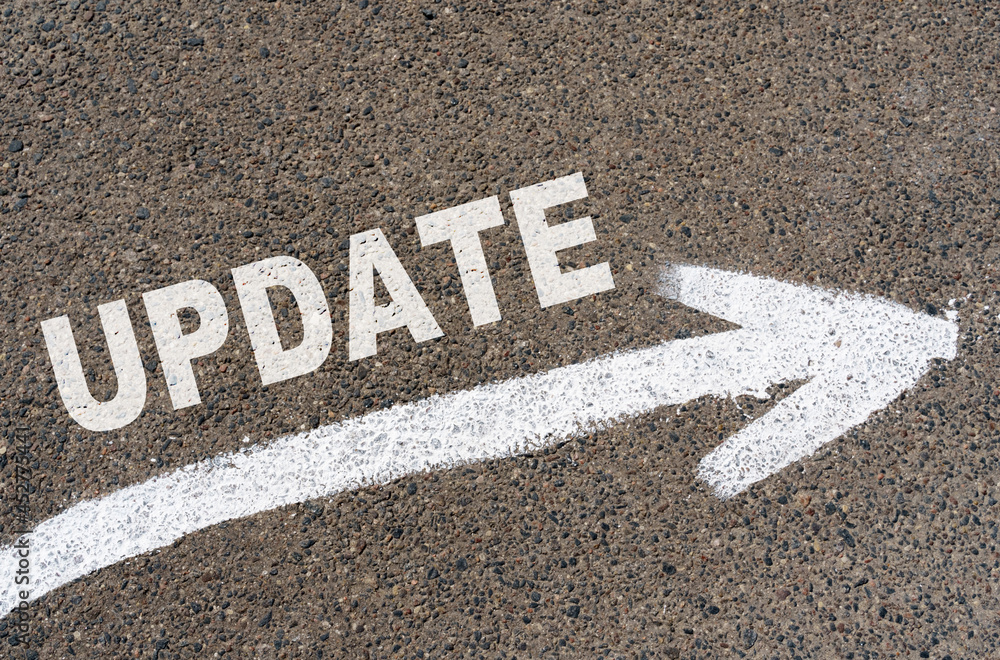 On the asphalt road markings an arrow with the inscription - UPDATE ...