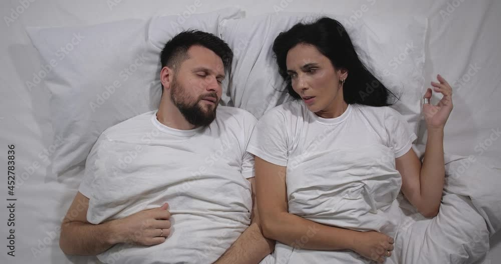 Top view hyper lapse of caucasian couple sleeping in bed with white ...