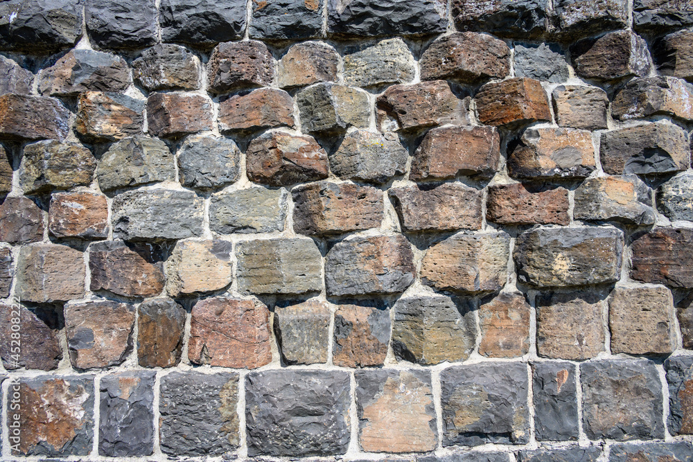 Hand carved blocks in a rustic wall, as an abstract background Stock ...