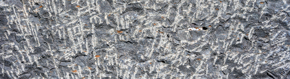 Tool marks in stone, left as part of the process to hand carve stone ...