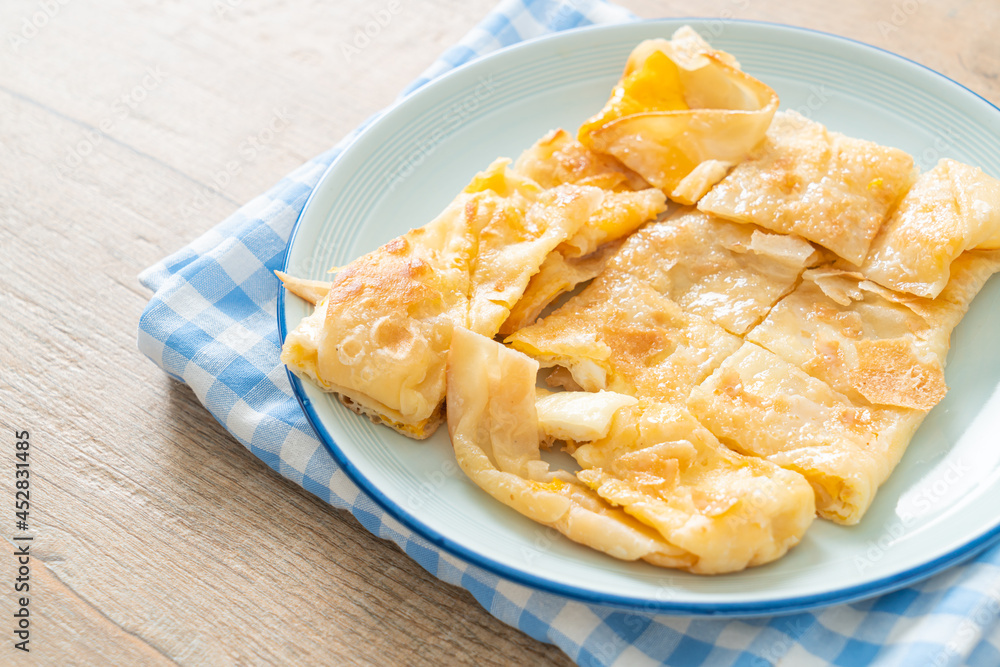 roti with egg and sweetened condensed milk Stock Photo | Adobe Stock