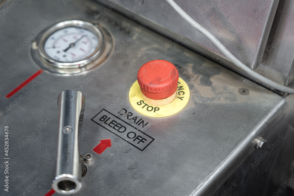 Red button of emergency pressure bleed-off on the pumping unit control ...