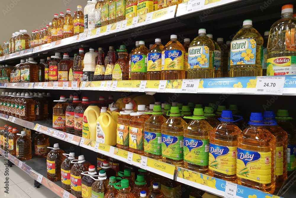 Various choices of healthy cooking oil on store shelf in Aeon grocery ...