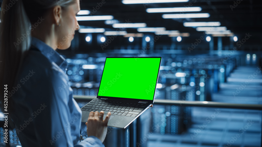 Female It Specialist Using Chroma Key Laptop in Data Center. Big Server ... Female It Specialist Using Chroma Key Laptop in Data Center. Big Server ...
