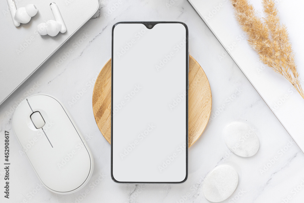 Mock up screen smartphone on marble office table. Minimal business ...