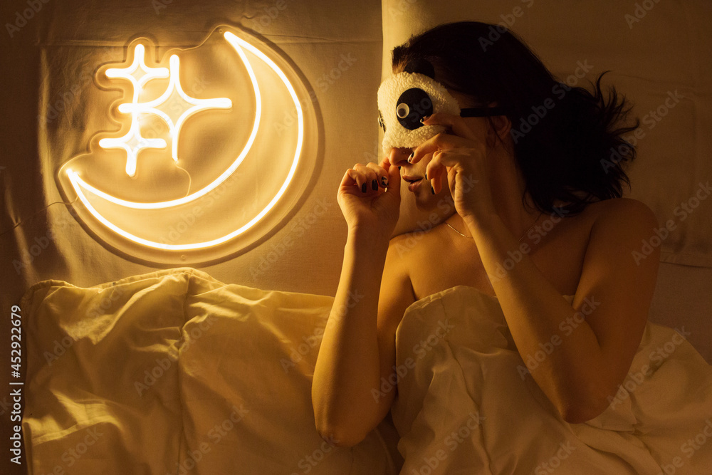 Beautiful girl with neon signs. A beautiful girl is sleeping next to a ...