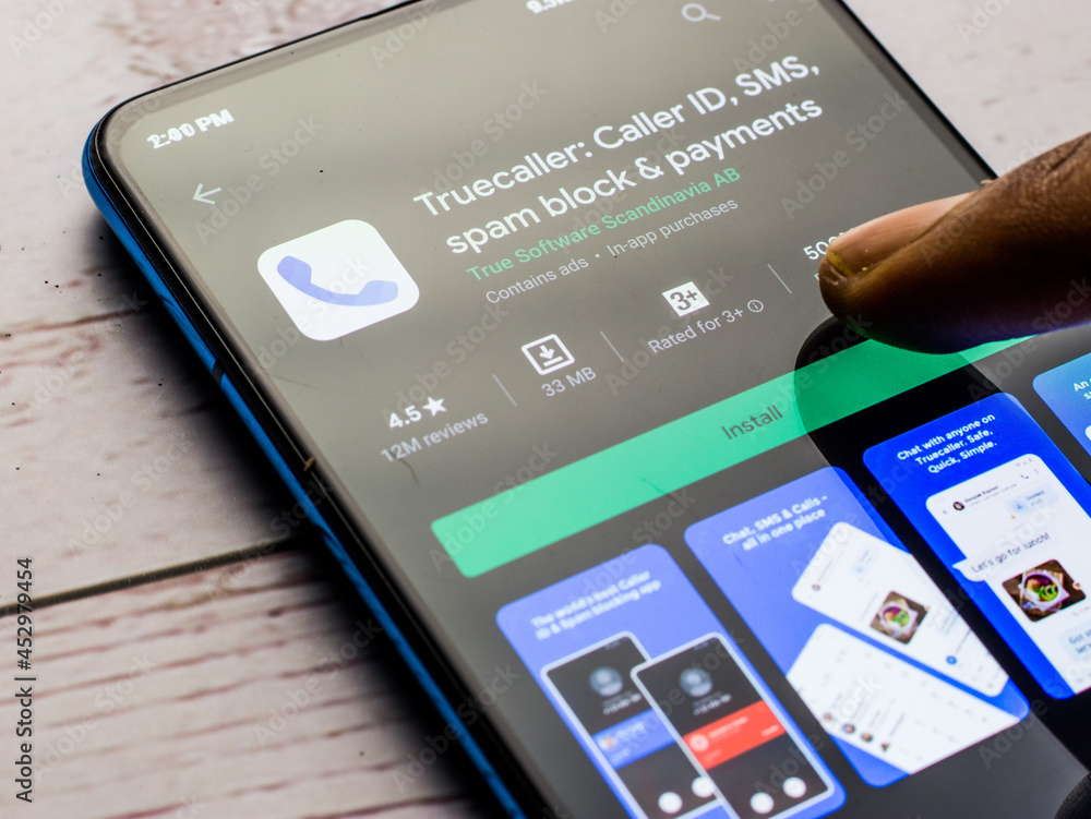 Downloading truecaller mobile app from google play store photographed ...