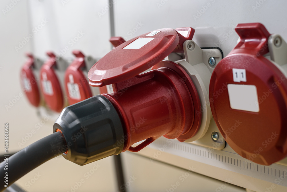 Industrial sockets and plug on distribution board. Construction site ...
