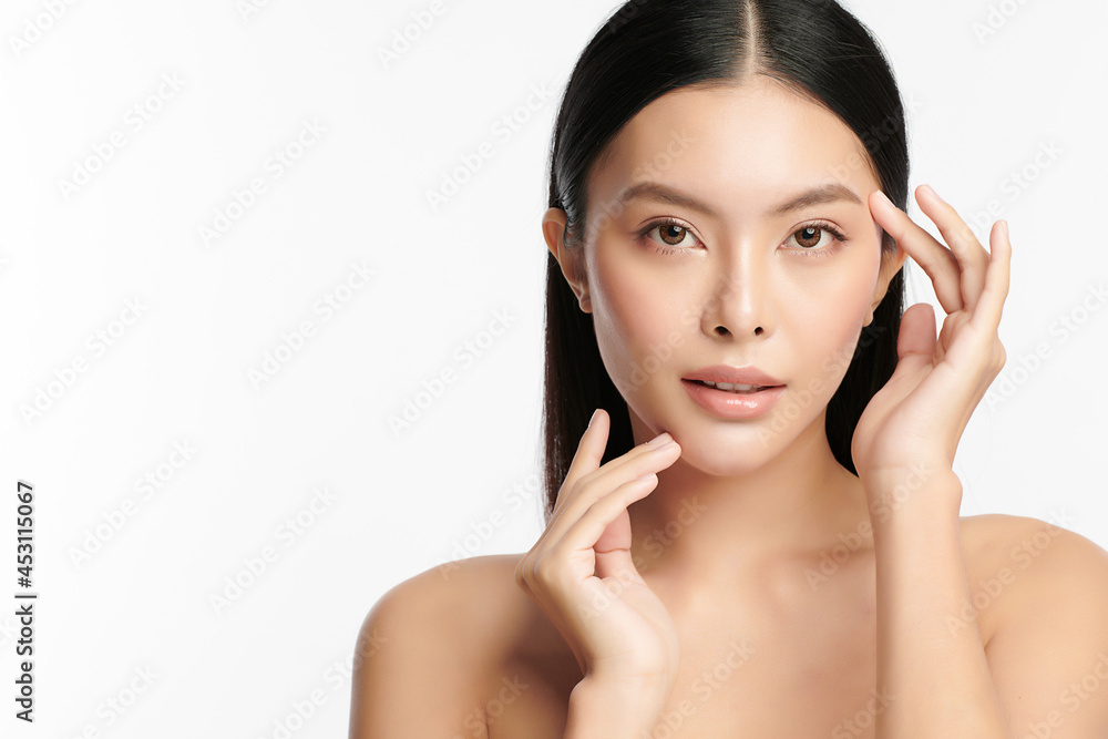 Beautiful young asian woman with clean fresh skin on white background ...