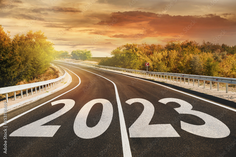 Start new year with fresh vision and ideas. 2023 numbers on asphalt ...