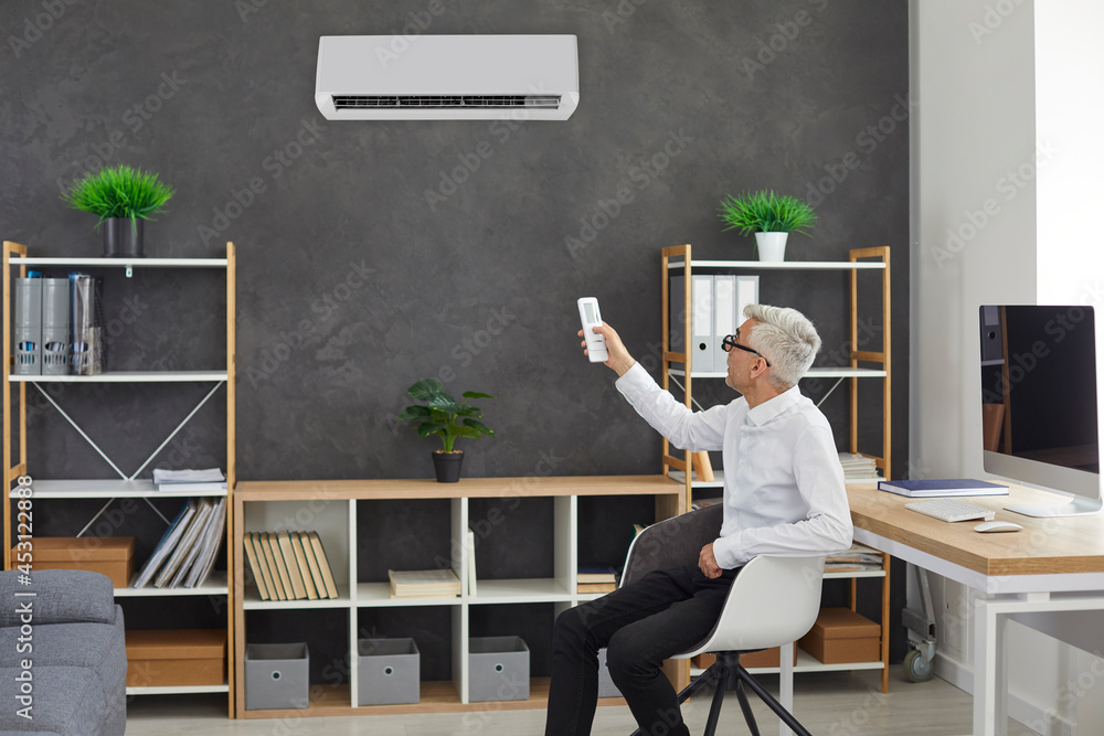 Middle-aged businessman male employee hold remote turn modern air ...