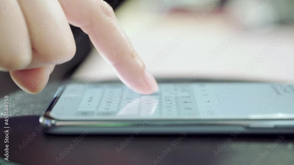 Close-up video of a woman's hand using index finger type english ...