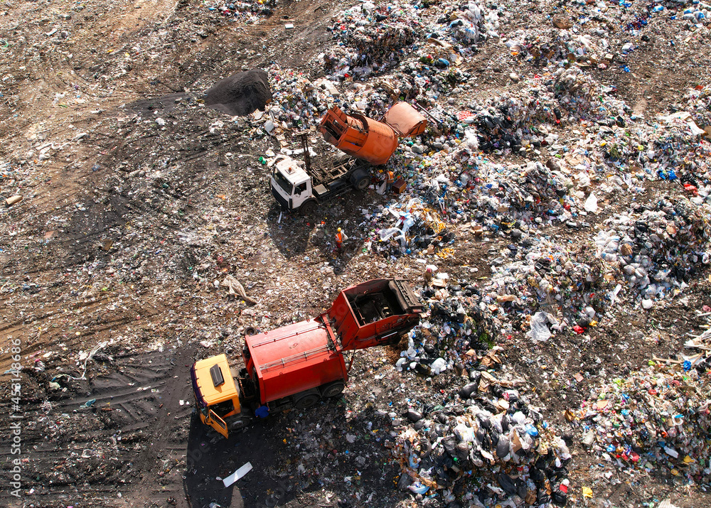 Garbage dump with food waste. Arial view of garbage truck unloads ...