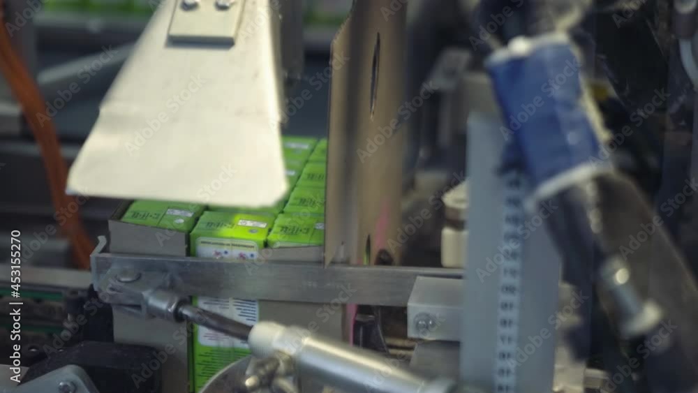 Automated Machine Places Milk Cartons Into Cardboard Box. Packaging ...