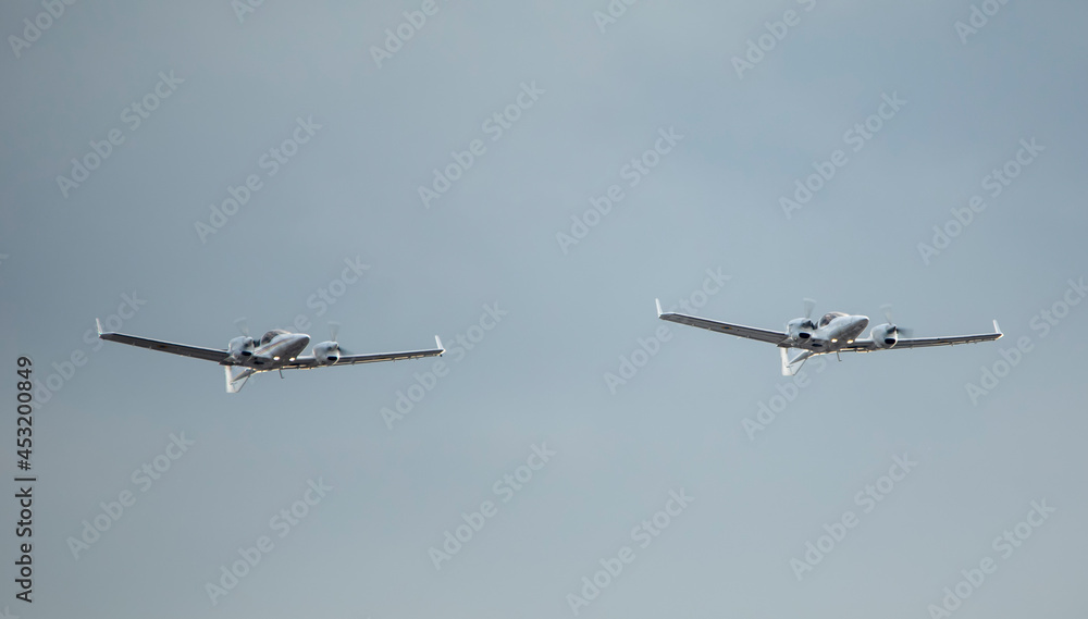Small two twin-engine propeller military reconnaissance aircraft on a ...