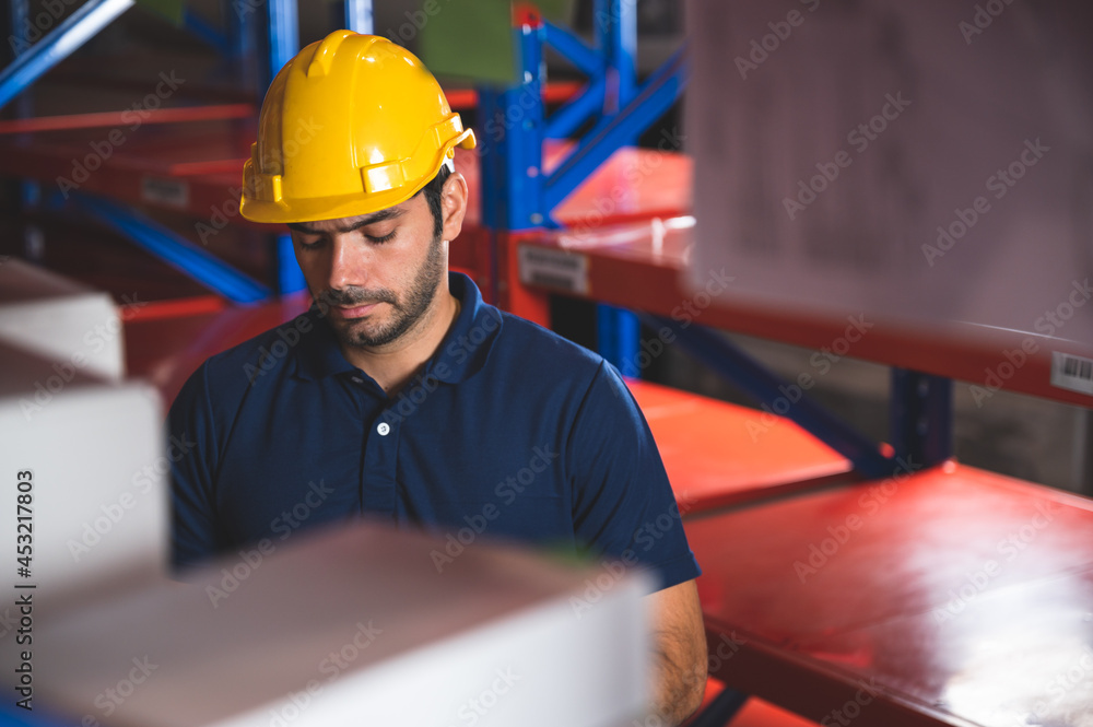 Handsome young male employee concentrating and focusing on work wearing ...