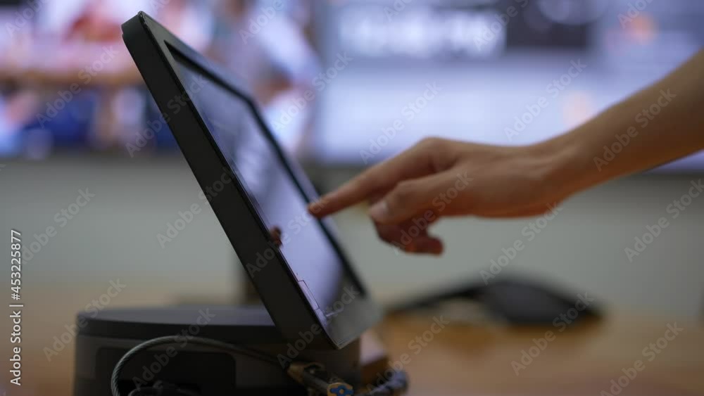 Finger touch the screen during conference in the meeting room with ...