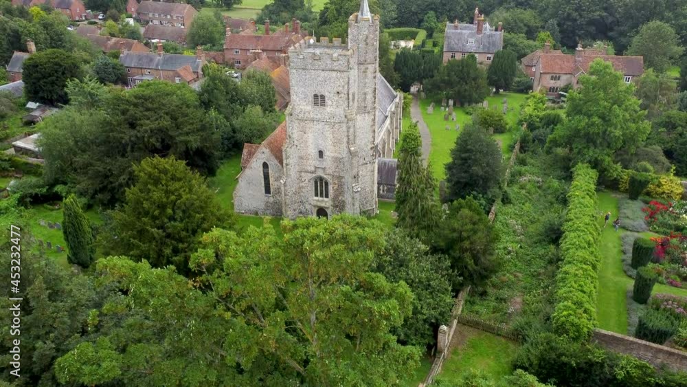 Aerial Reveal Of Old Church Behind Tree In Parish Village In Kent ...