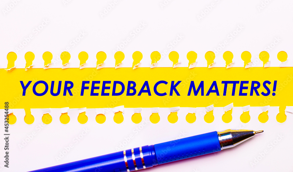 Blue pen and white torn paper stripes on a bright yellow background ...