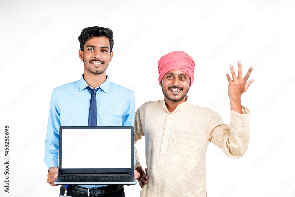 Young indian officer showing laptop screen with farmer on white ...