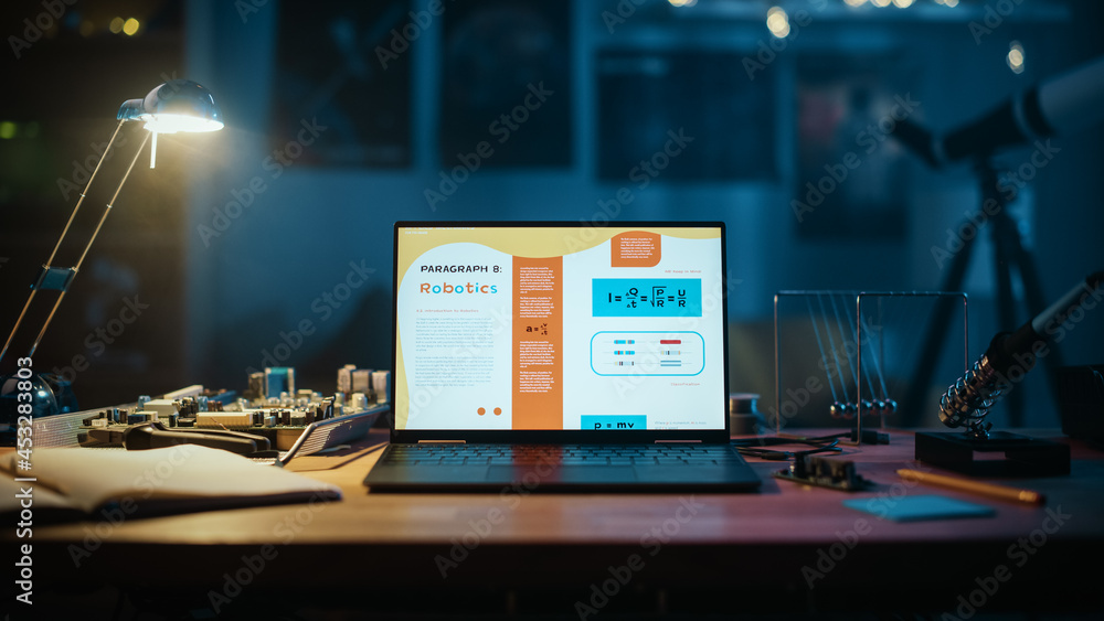 Laptop Computer Standing on a Table with a Science Homework School ...