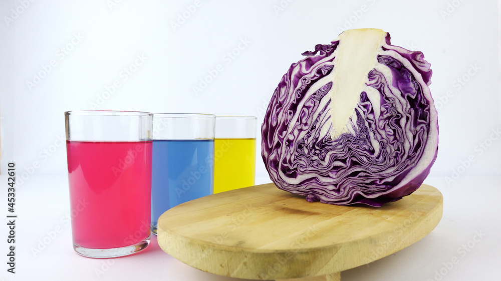 Red cabbage and three glasses filled with colored liquid. Make a ...