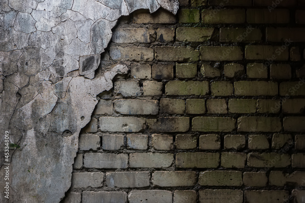 wet brick wall and crumbling cement plaster. Stock Photo | Adobe Stock