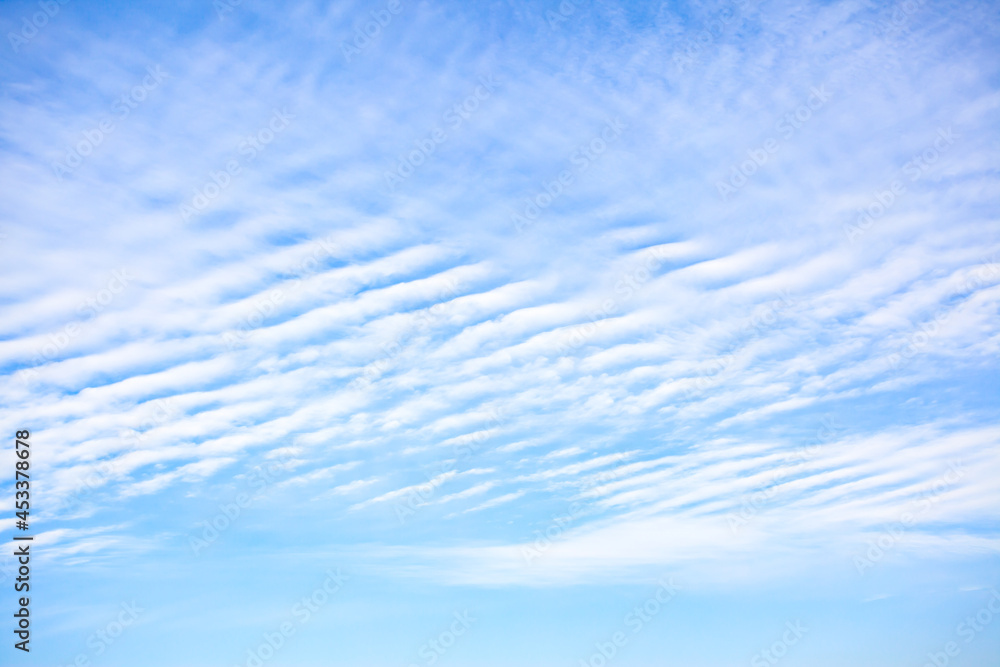 Wavy clouds in blue sky Stock Photo | Adobe Stock