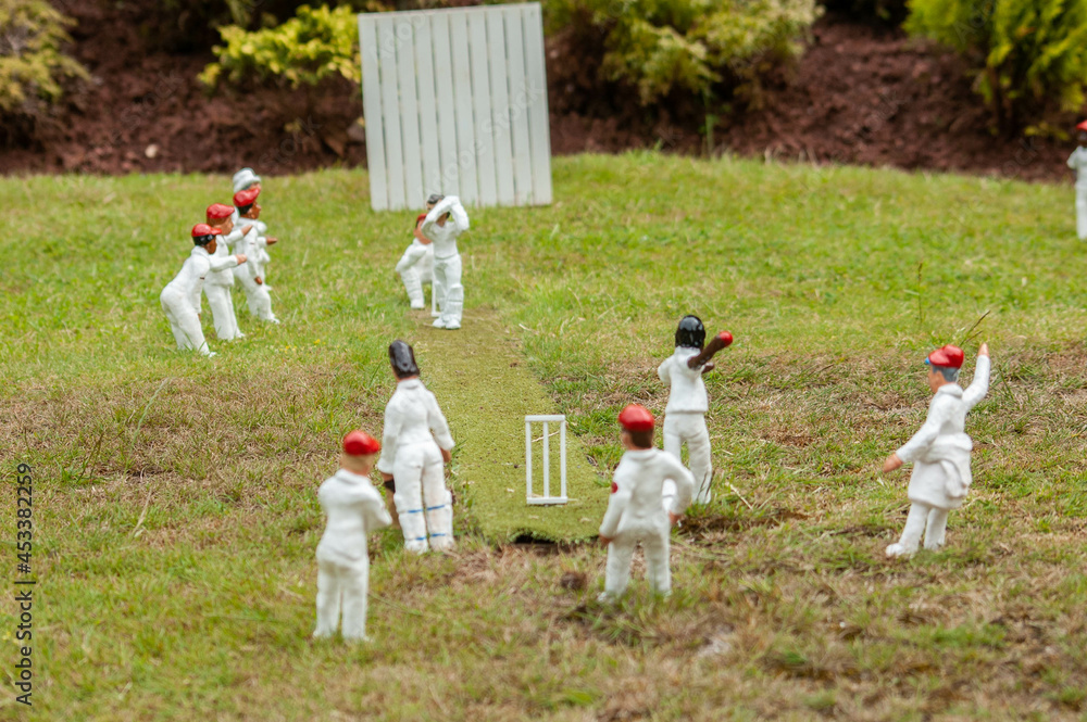 Closeup photo of tiny model cricket players on grass Stock Photo ...