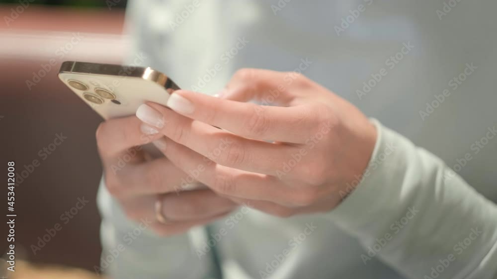 4k. woman using iPhone 12 smartphone pressing finger, reading social ...