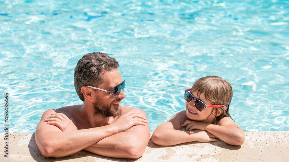 dad and child having fun at pool party. childhood and parenting. father ...