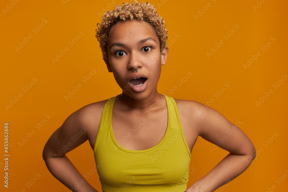 Shock face expression. Blonde woman of mixed race posing with jaw ...