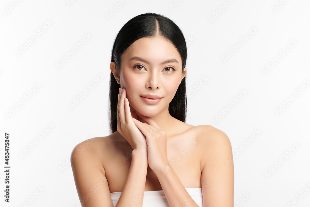Beautiful young asian woman with clean fresh skin on white background ...