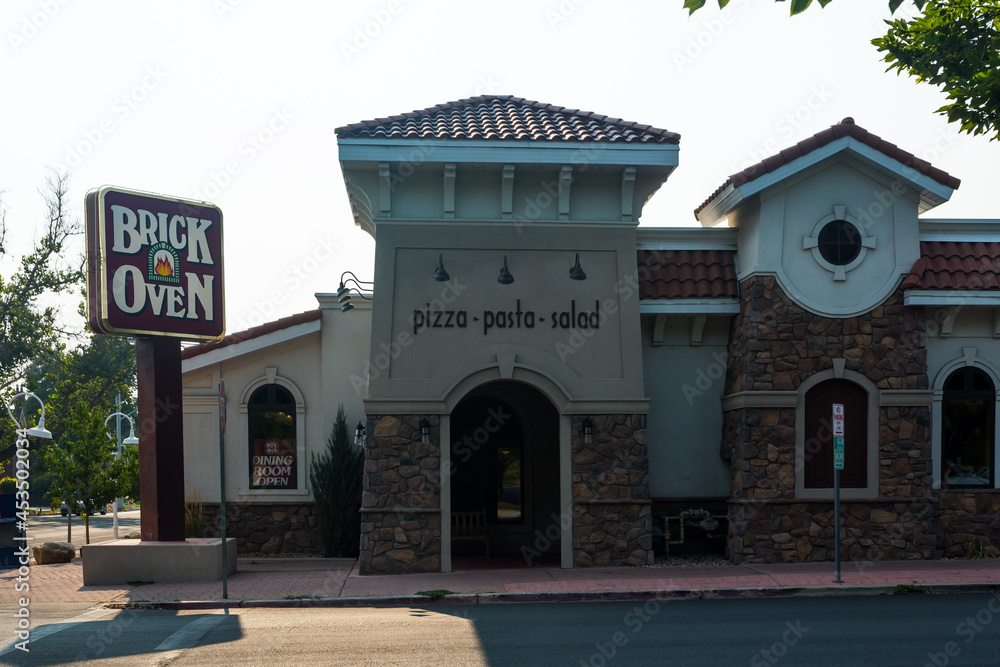 Popular Italian cuisine restaurant "Brick Oven" building street view in ...