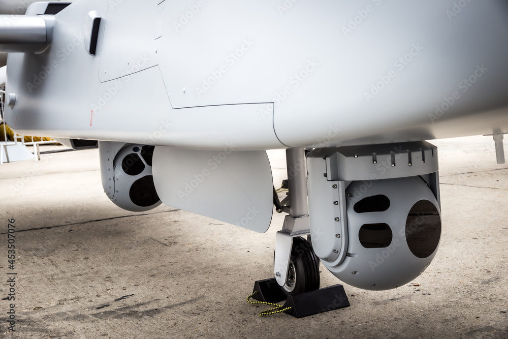 Camera sensor pods under an unmanned aerial surveillance drone aircraft ...